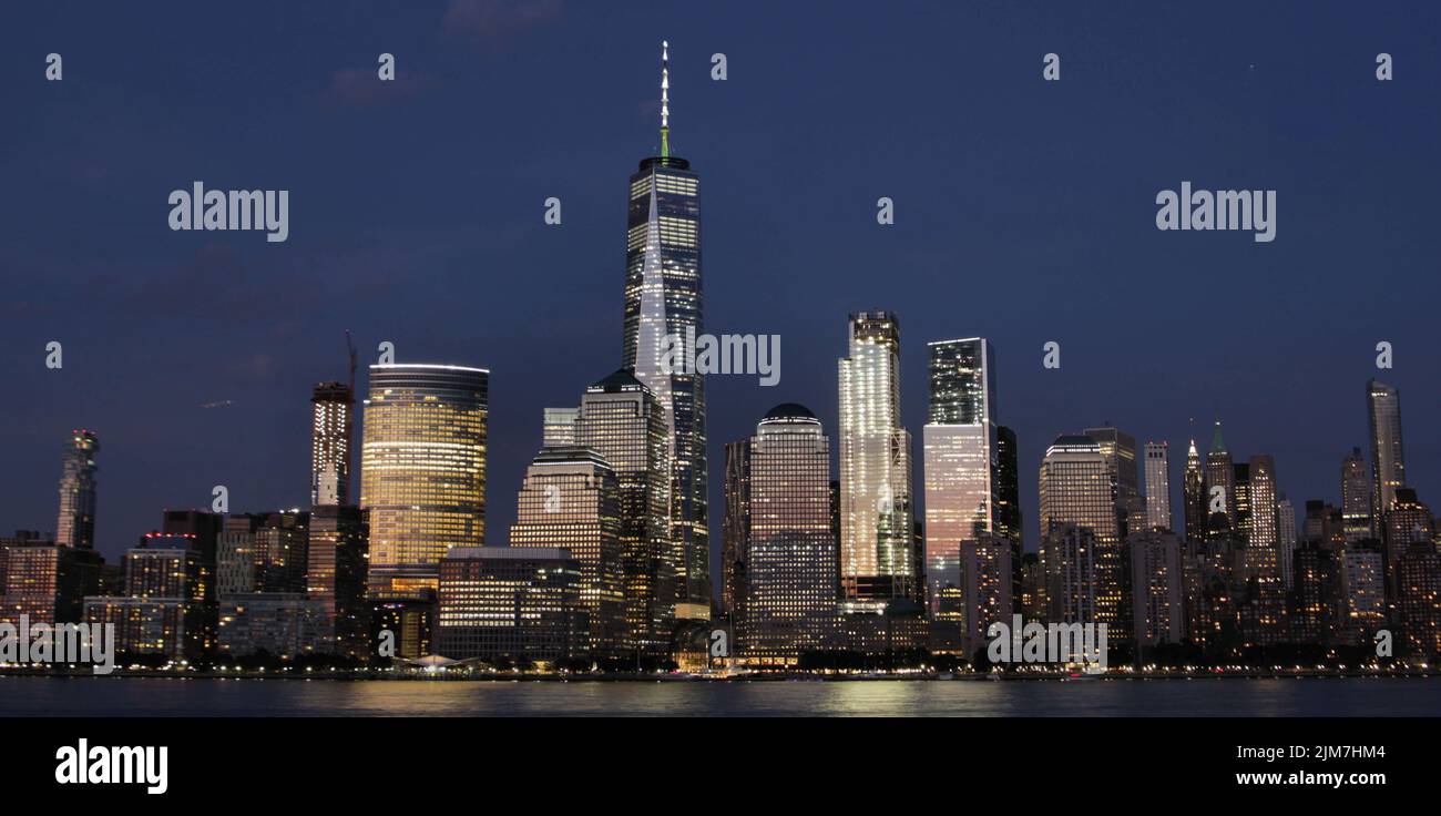 Manhattan Sky Scrapers, cityscape on the Hudson river against a blue ...