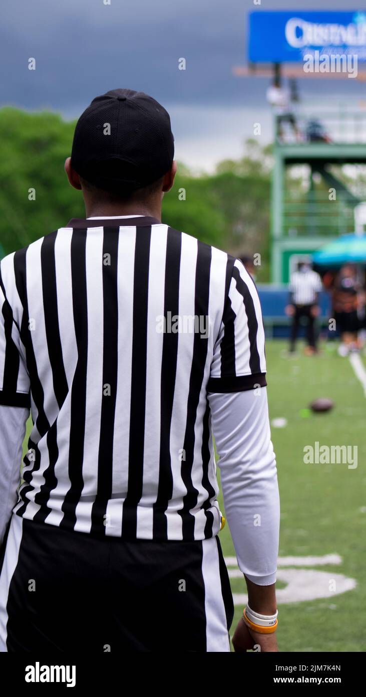 Referee with ball back hi-res stock photography and images - Alamy