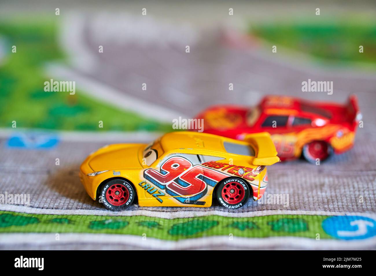 The Mattel toy model cars from the Disney Pixar Cars movie on a playmat ...