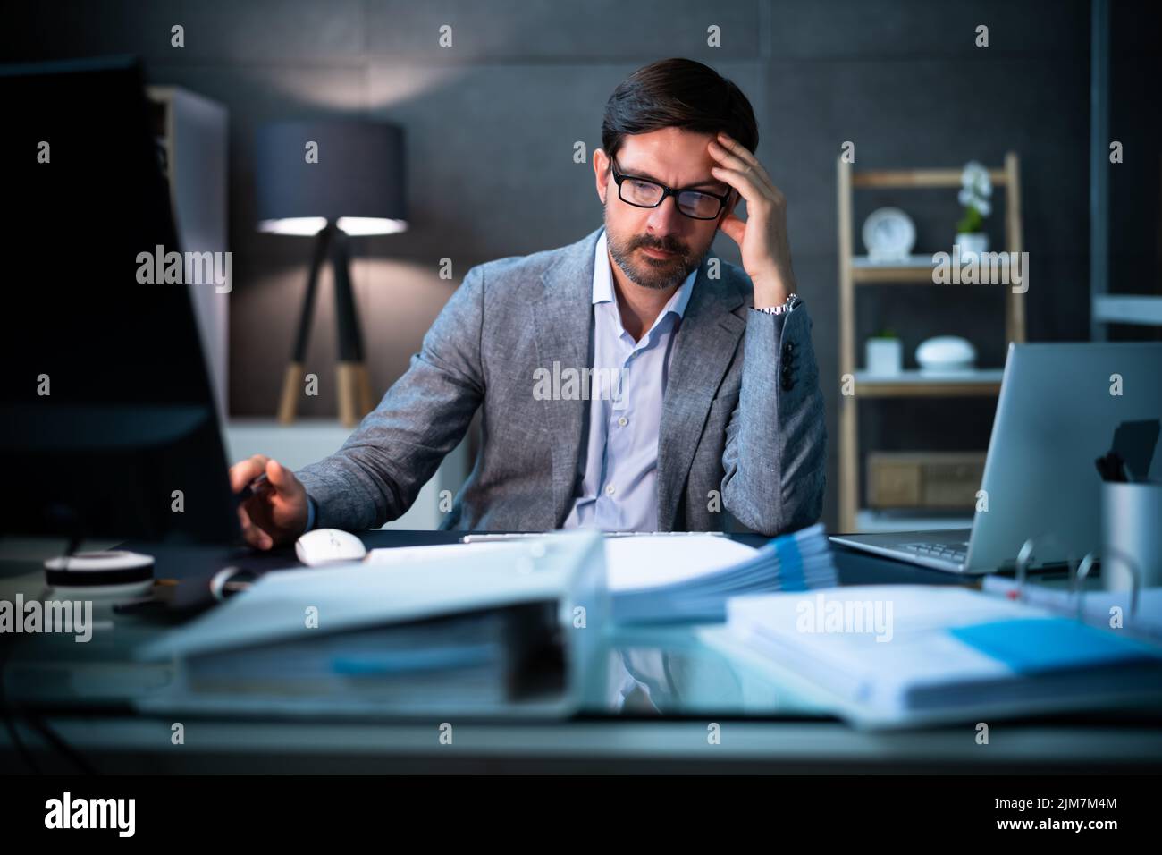 Stressed Tax Advisor With Headache. Sad Accountant Stock Photo - Alamy