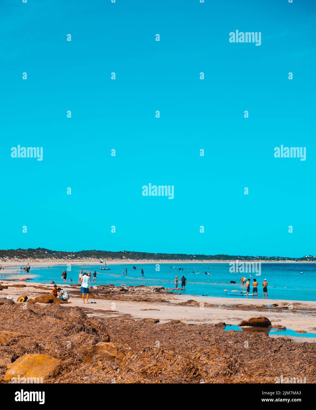 Shot of people enjoying the beach of Port Hughes, South Australia Stock ...