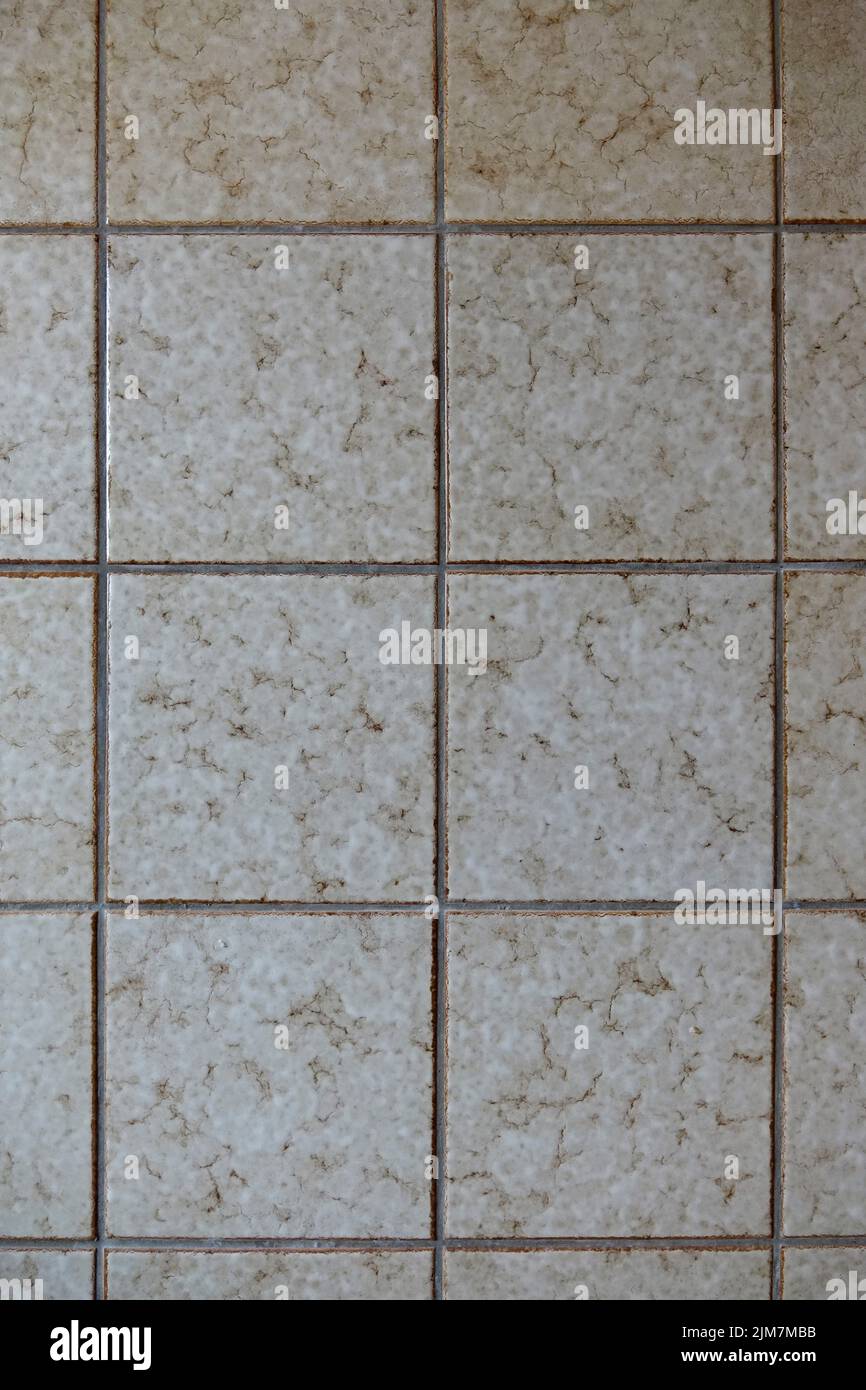 Close up: Beige tile wall, grey filling gaps, German 70s design, use ...