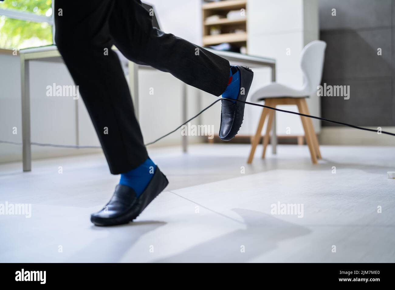 Wire Cord Trip Over And Fall. Feet Stumble On Cable Stock Photo - Alamy
