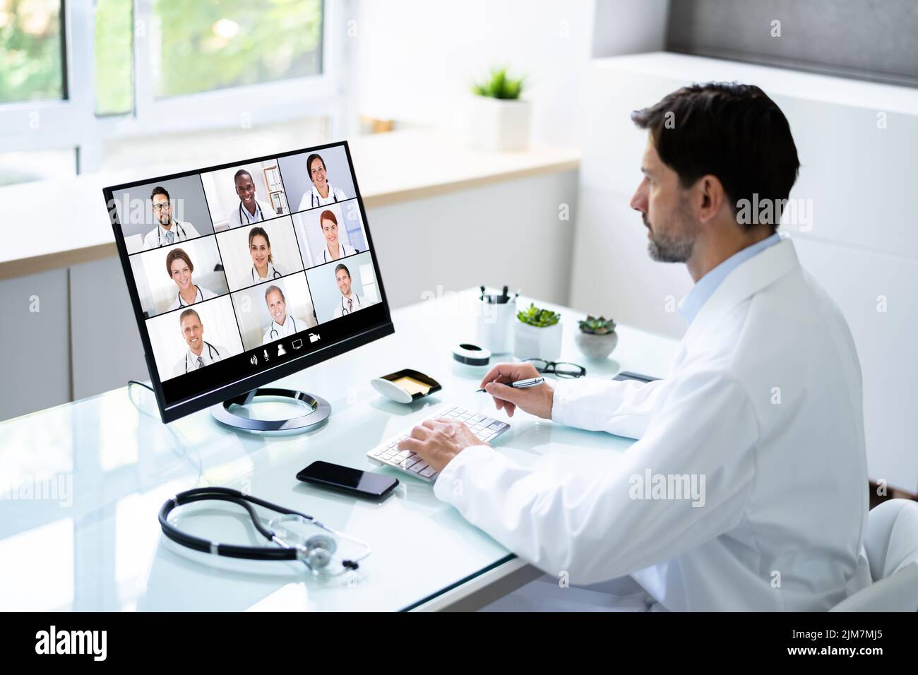 Medical Doctor Holding Online Elearning Video Conference Stock Photo ...
