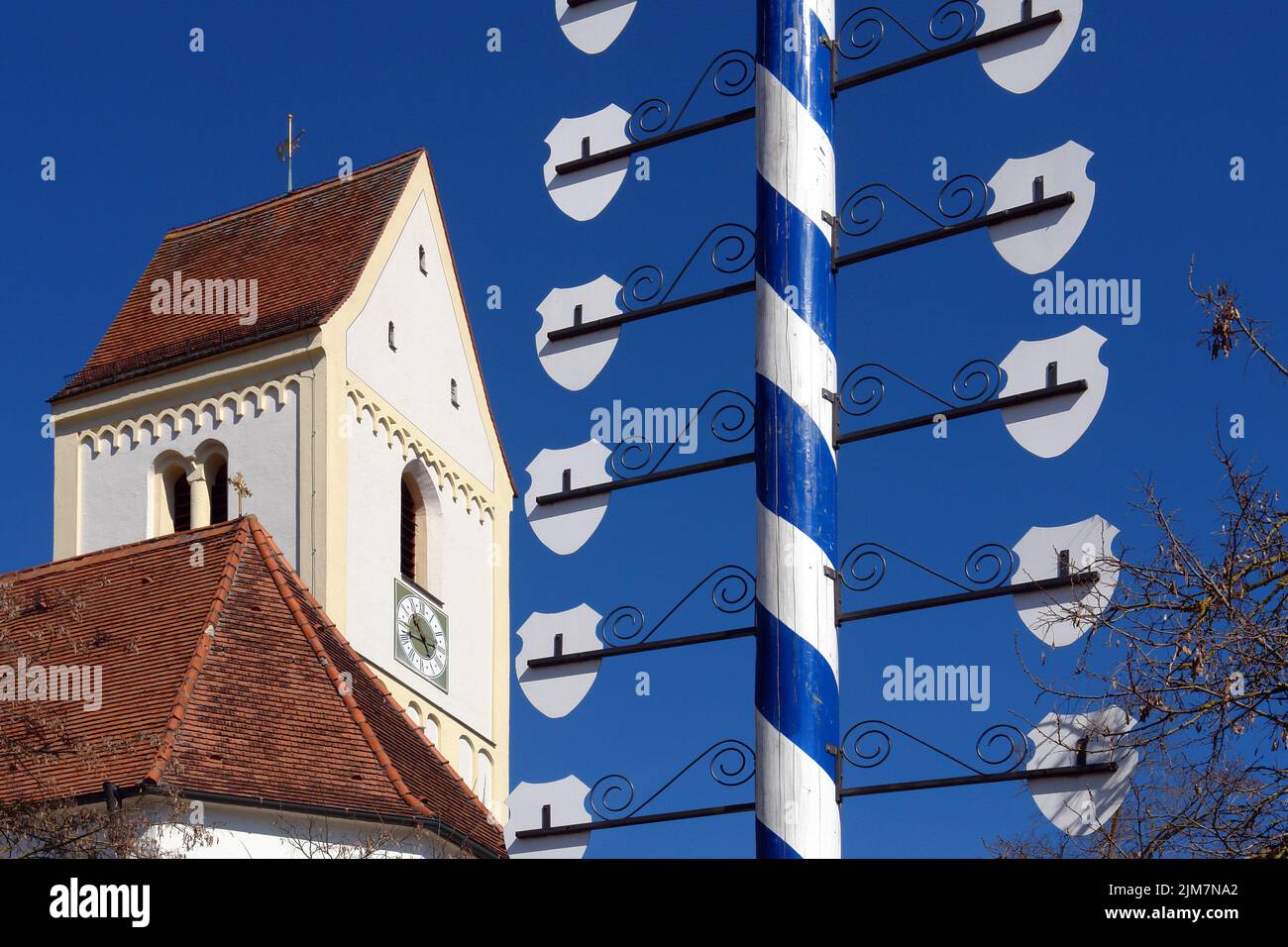Church tower with maypole Stock Photo - Alamy