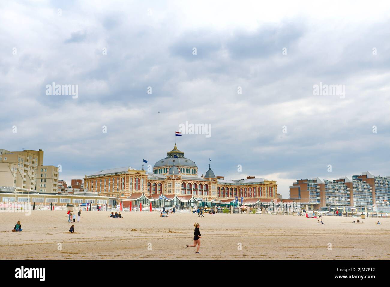 The Kurhaus hotel of Scheveningen with a runner on the beach in the ...