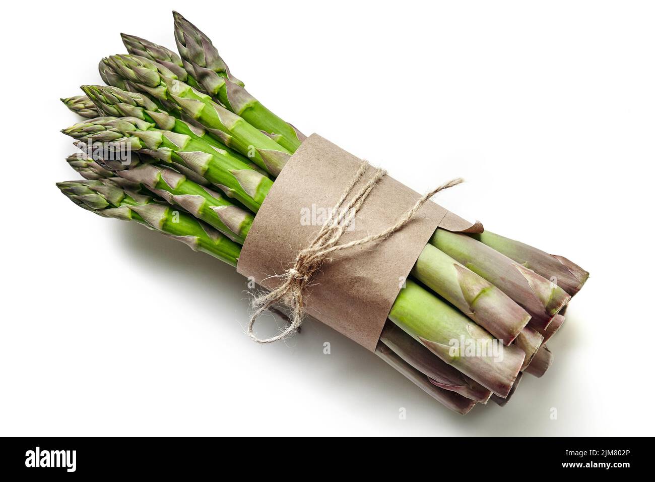 An edible, raw stems of asparagus isolated on white background Stock ...
