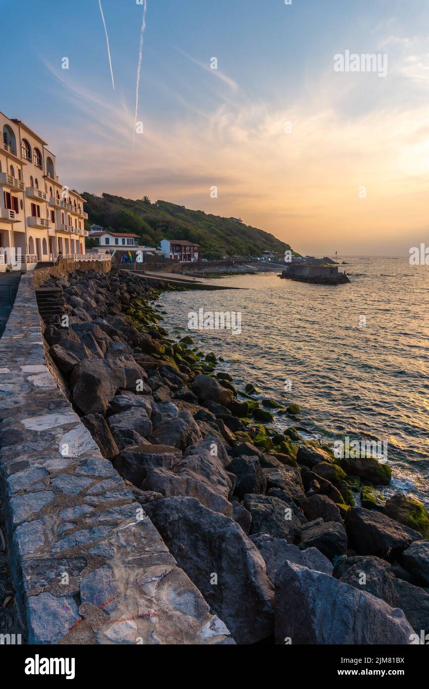An aerial beautiful sunset of the beach of Guethary with buildings ...