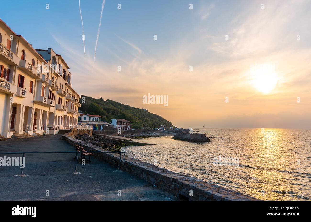 An aerial beautiful sunset of the beach of Guethary with buildings ...