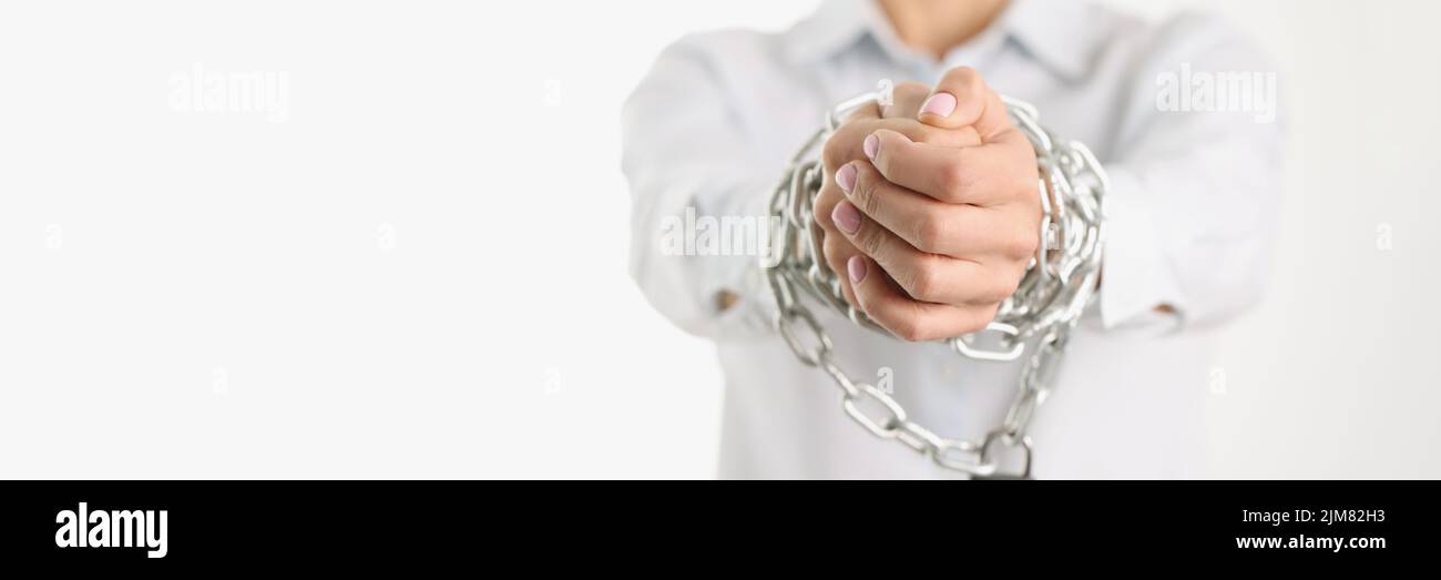 Women's hands are shackled with a large chain, close-up Stock Photo - Alamy