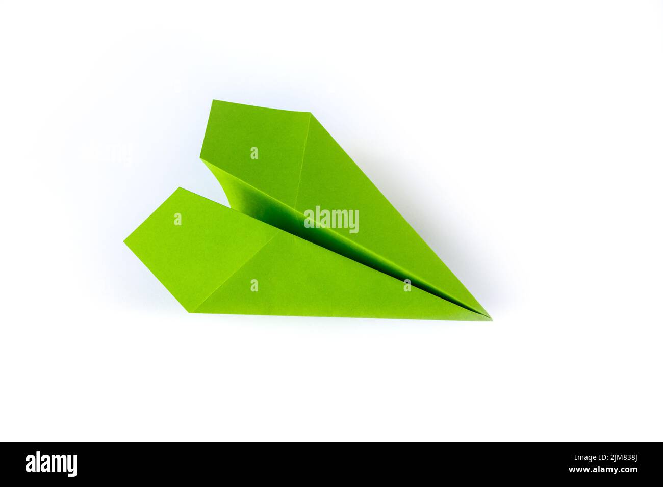 Green paper plane origami isolated on a blank white background Stock ...