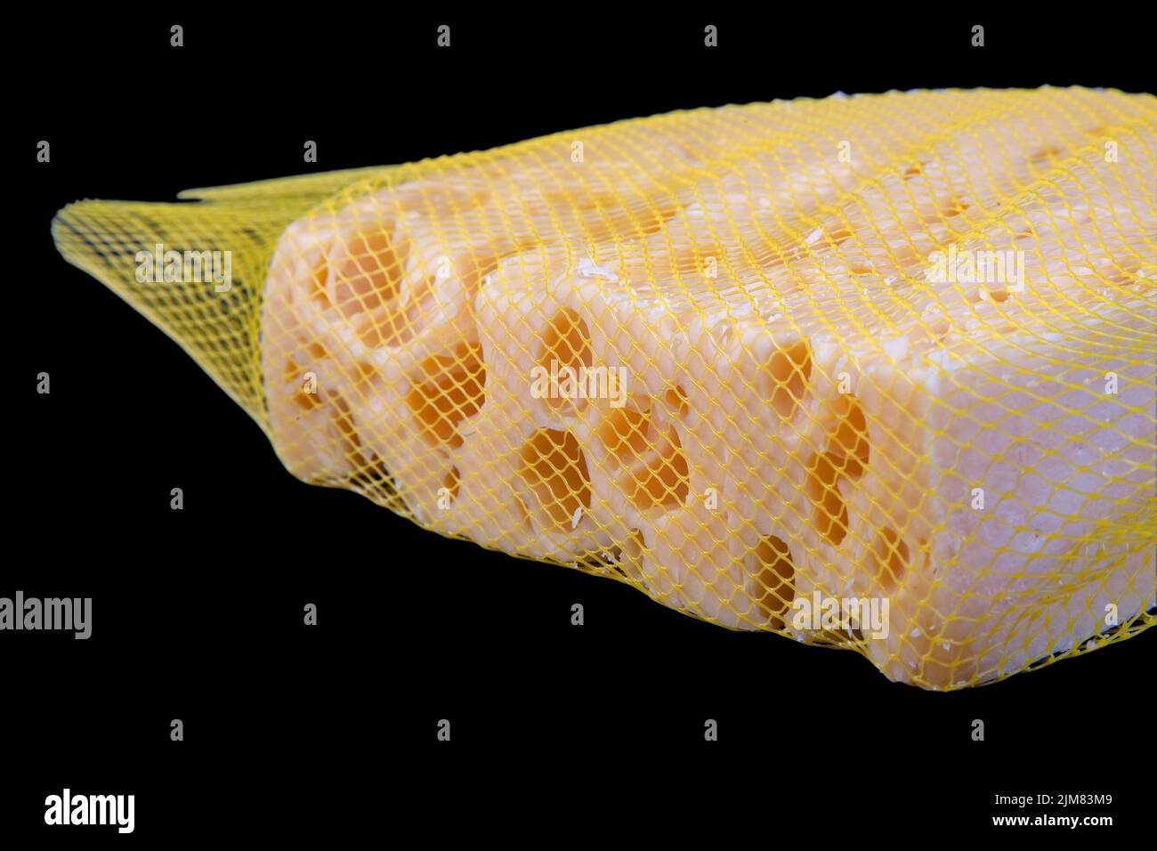 Cheese slice in net Stock Photo - Alamy