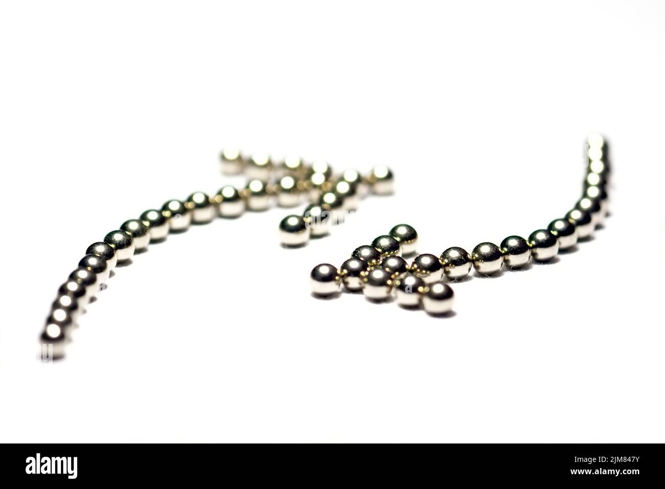 Macro arrows from metal balls Stock Photo - Alamy