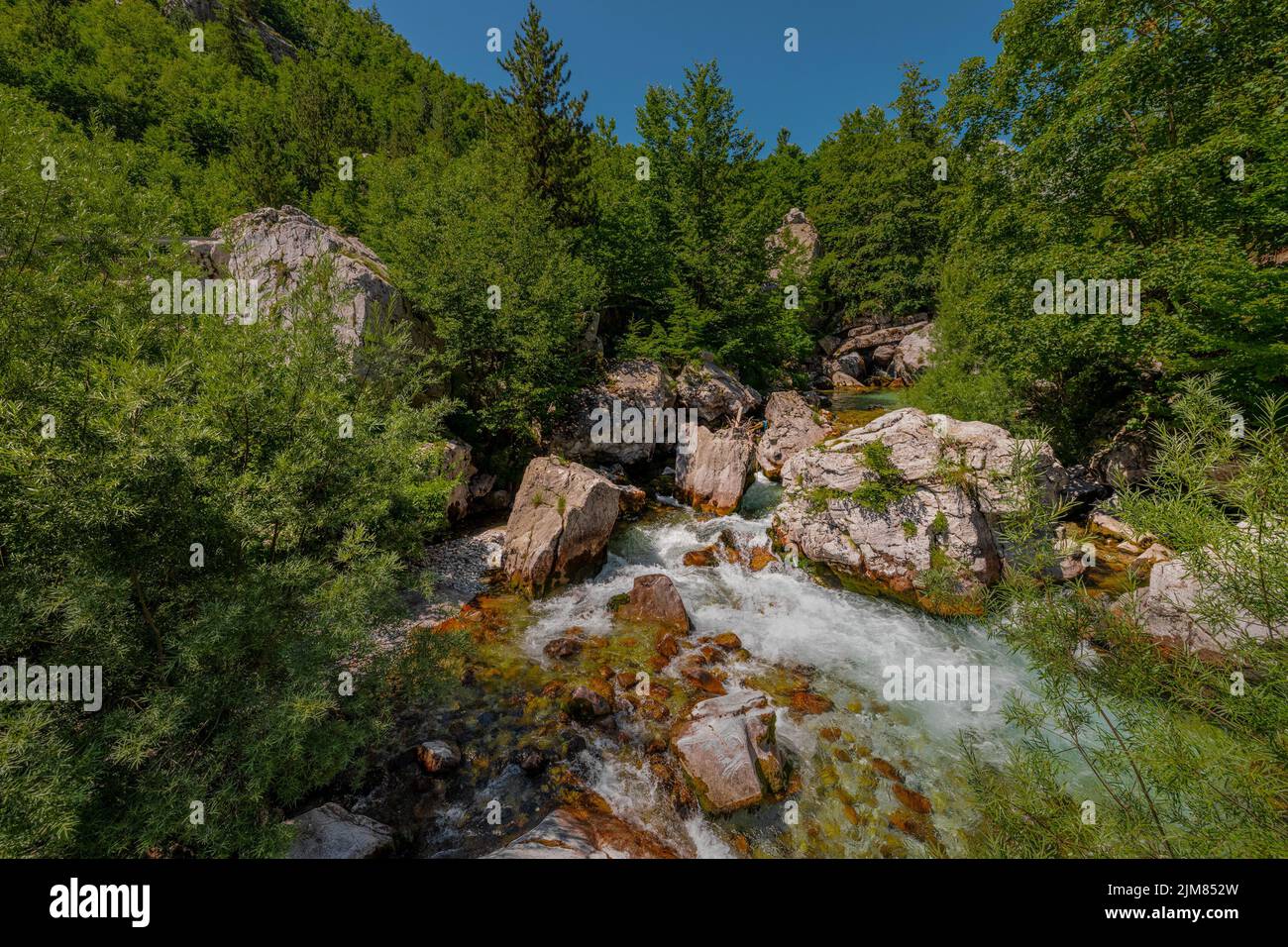 Valbone river rapids close to bridge to popular tourist attraction in ...