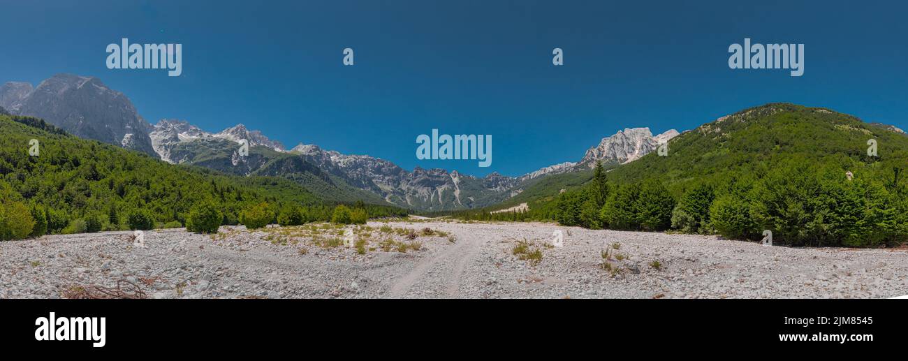 Hiking path on a dry riverbed leading from Valbona valley to Theth, a ...