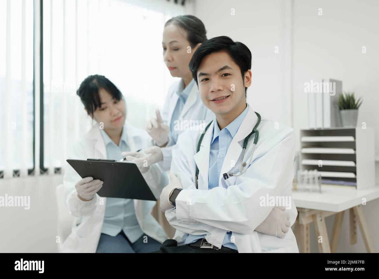 Group of science researchers analysing together at medical science ...