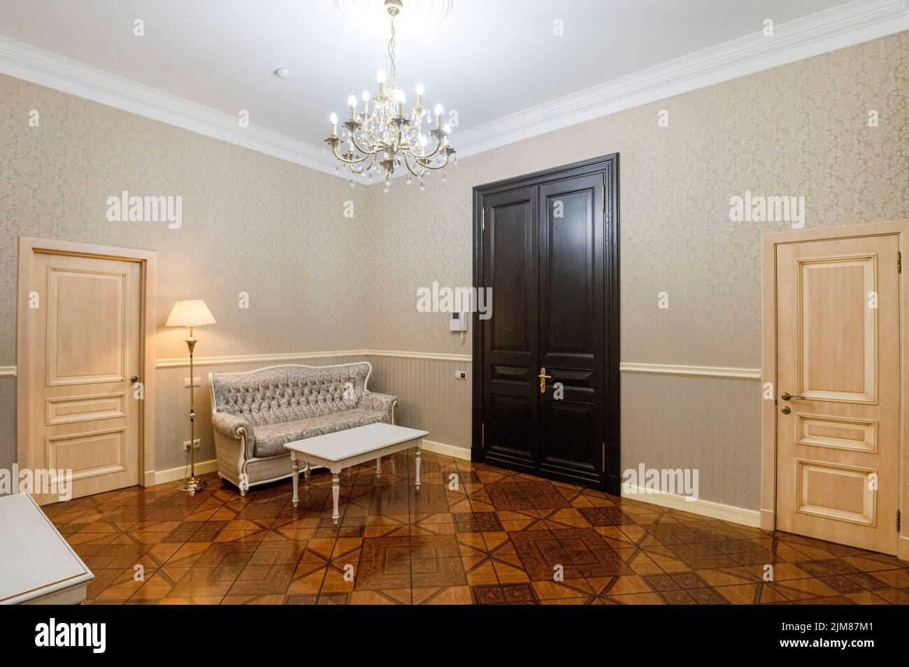 Spacious hall for guests house. Wooden lacquered floor and luxurious ...