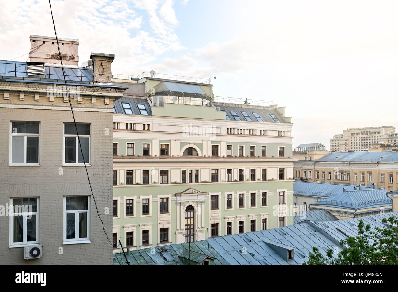 View of neighboring houses and city life from an open window Stock ...