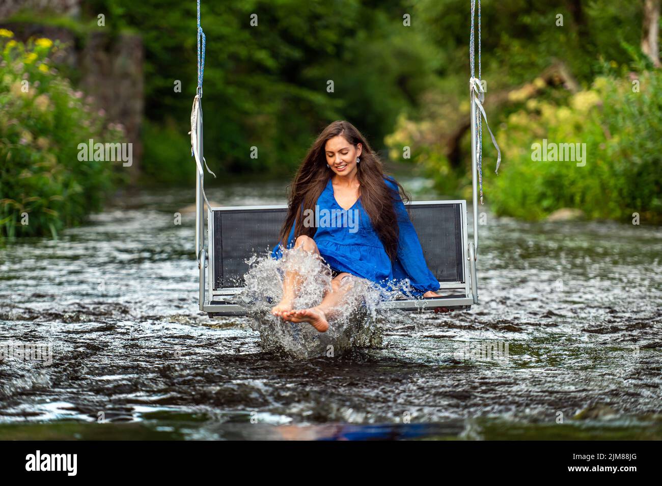Swings over water hi-res stock photography and images - Alamy