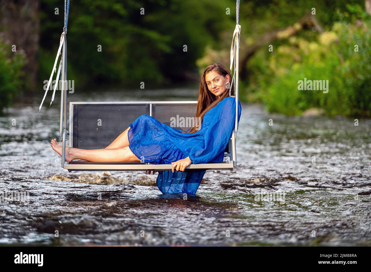 Swings over water hi-res stock photography and images - Alamy