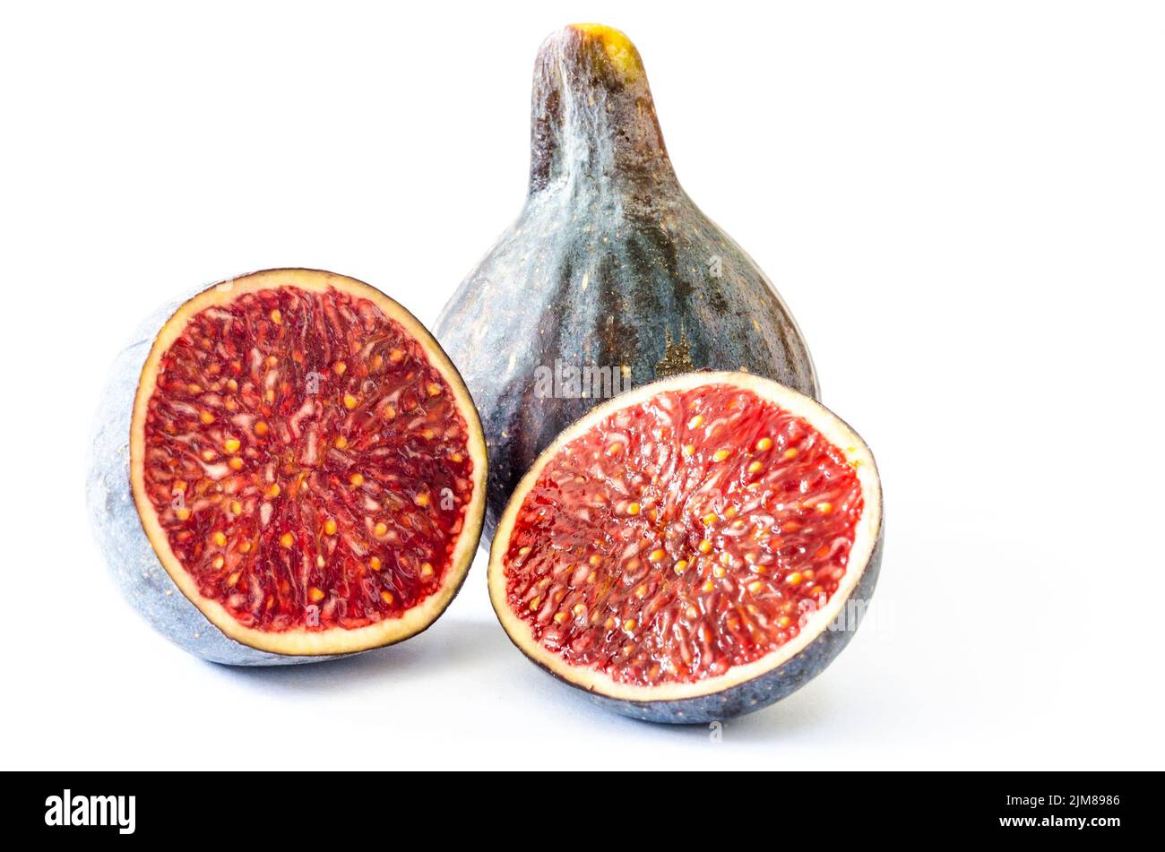 Fresh cut ripe fig fruit isolated on white background Stock Photo - Alamy