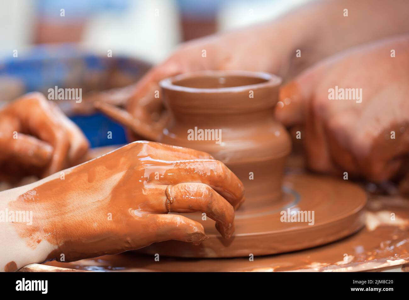 Clay potter hand Stock Photo - Alamy