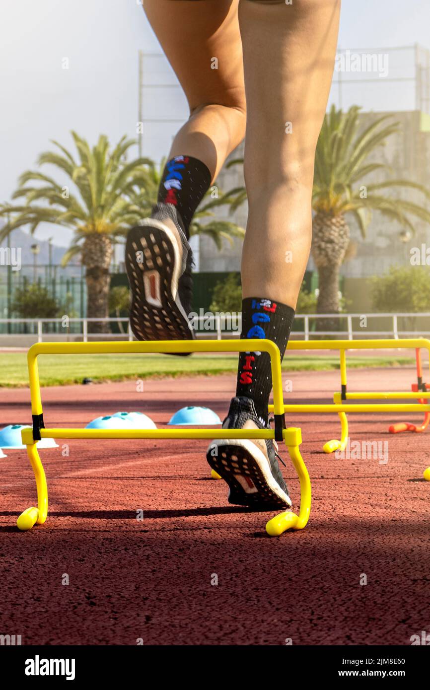 Jumping hurdles athlete hi-res stock photography and images - Alamy