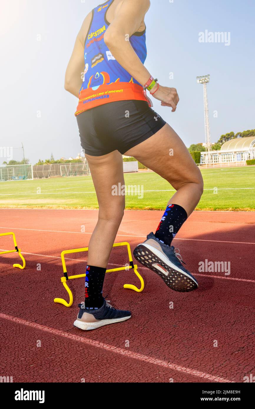 Jumping hurdles athlete hi-res stock photography and images - Alamy