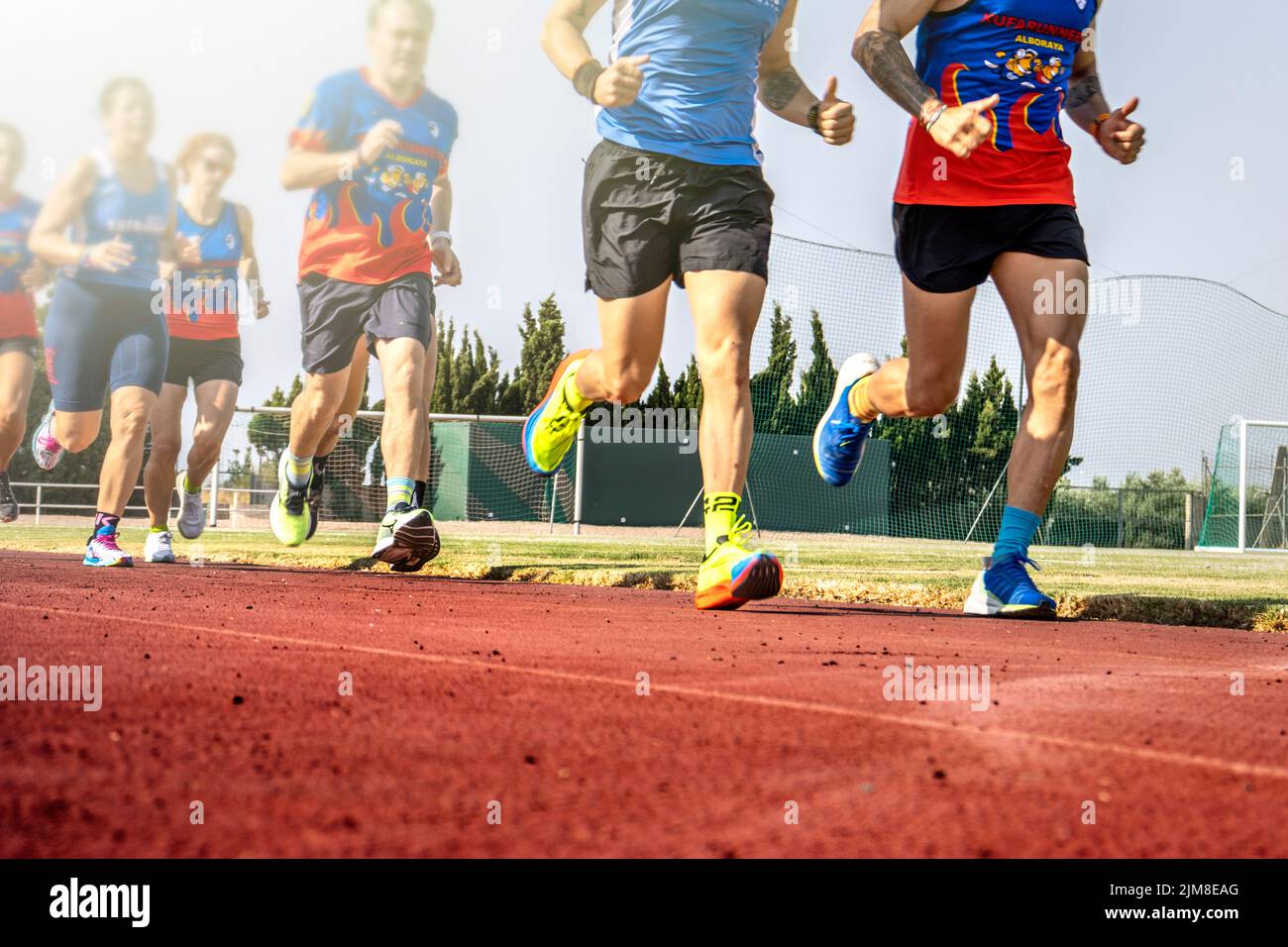 runners training on the sports track Stock Photo - Alamy