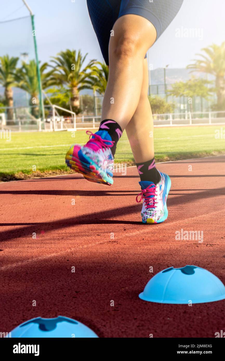 Female athlete sprinting stadium hi-res stock photography and images ...