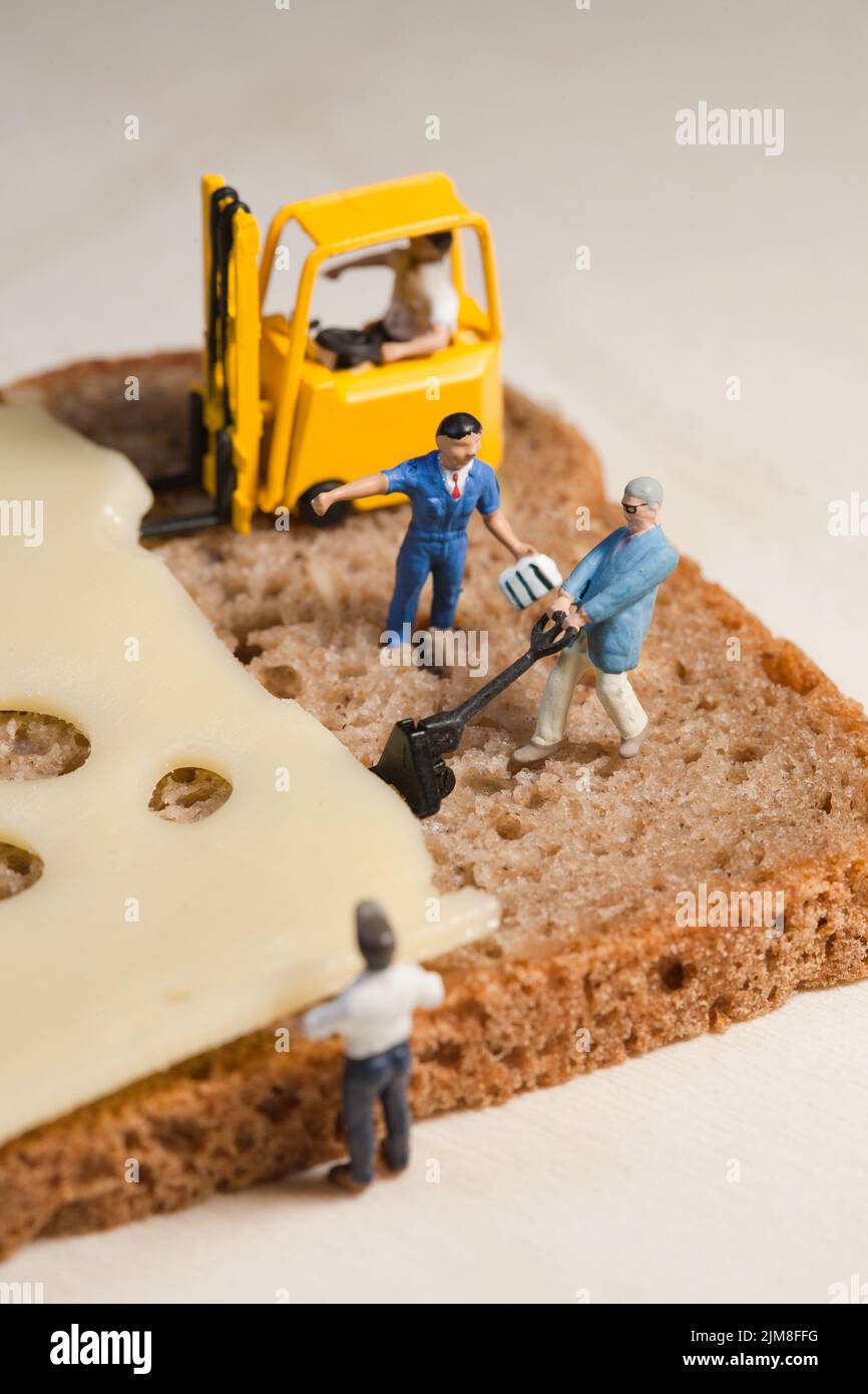 Miniature workers prepare a break snack Stock Photo - Alamy