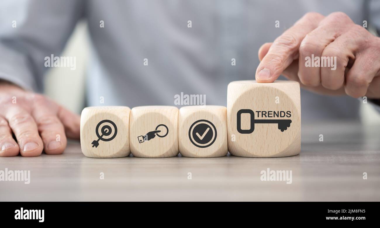 Wooden blocks with symbol of trends concept Stock Photo - Alamy