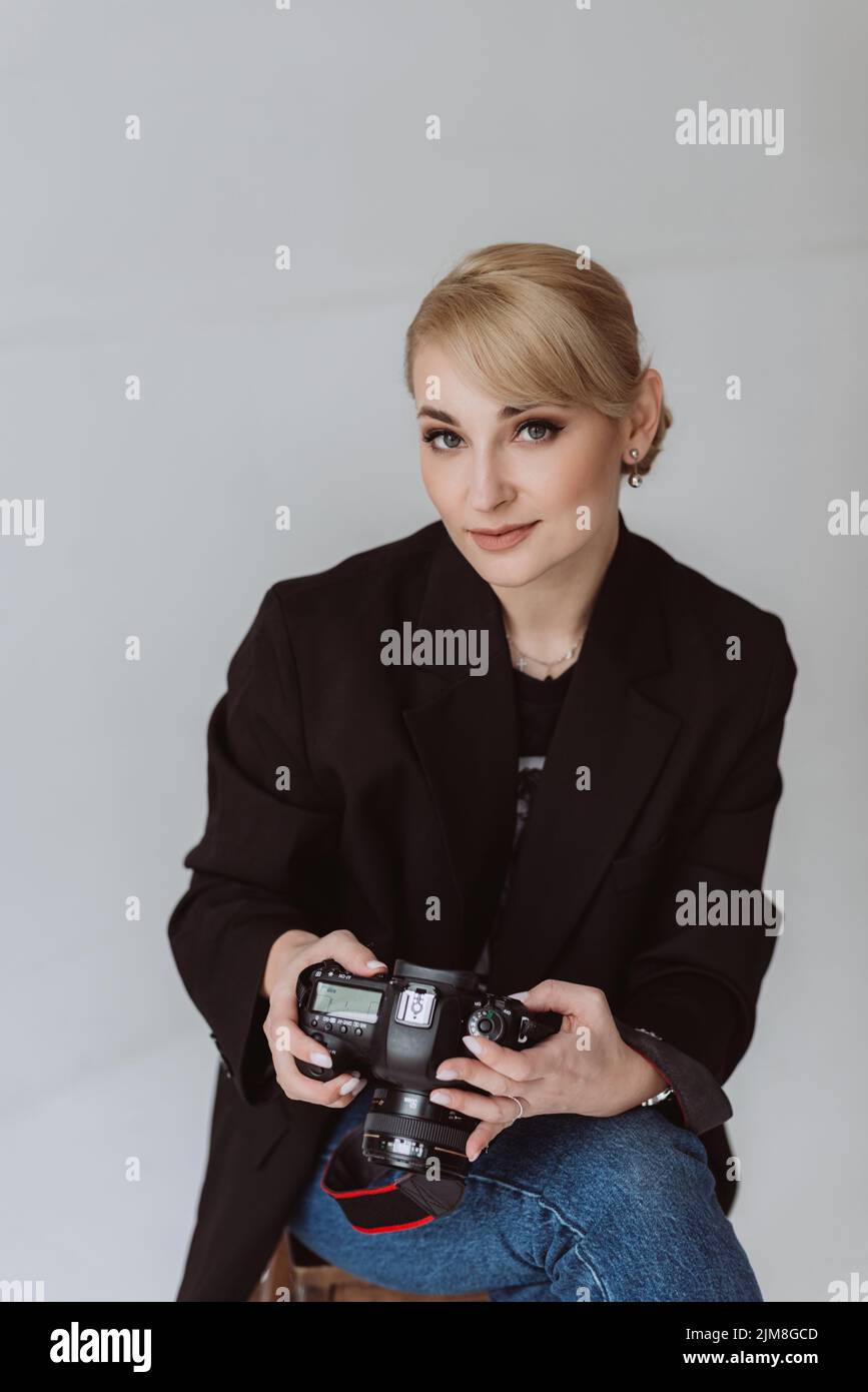 Beautiful woman photographer, journalist, posing with a camera in her ...