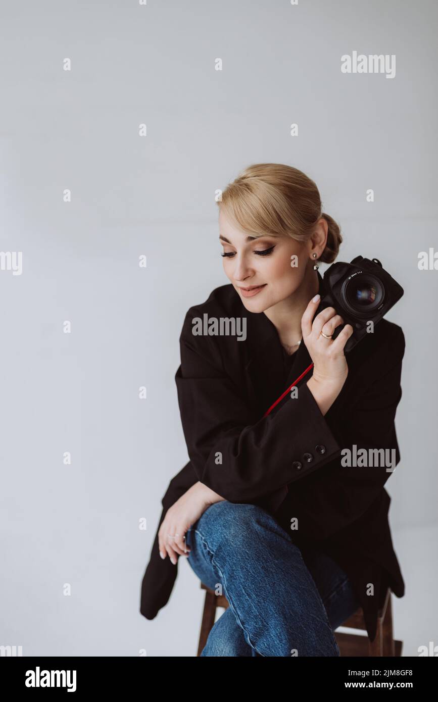 Beautiful woman photographer, journalist, posing with a camera in her ...