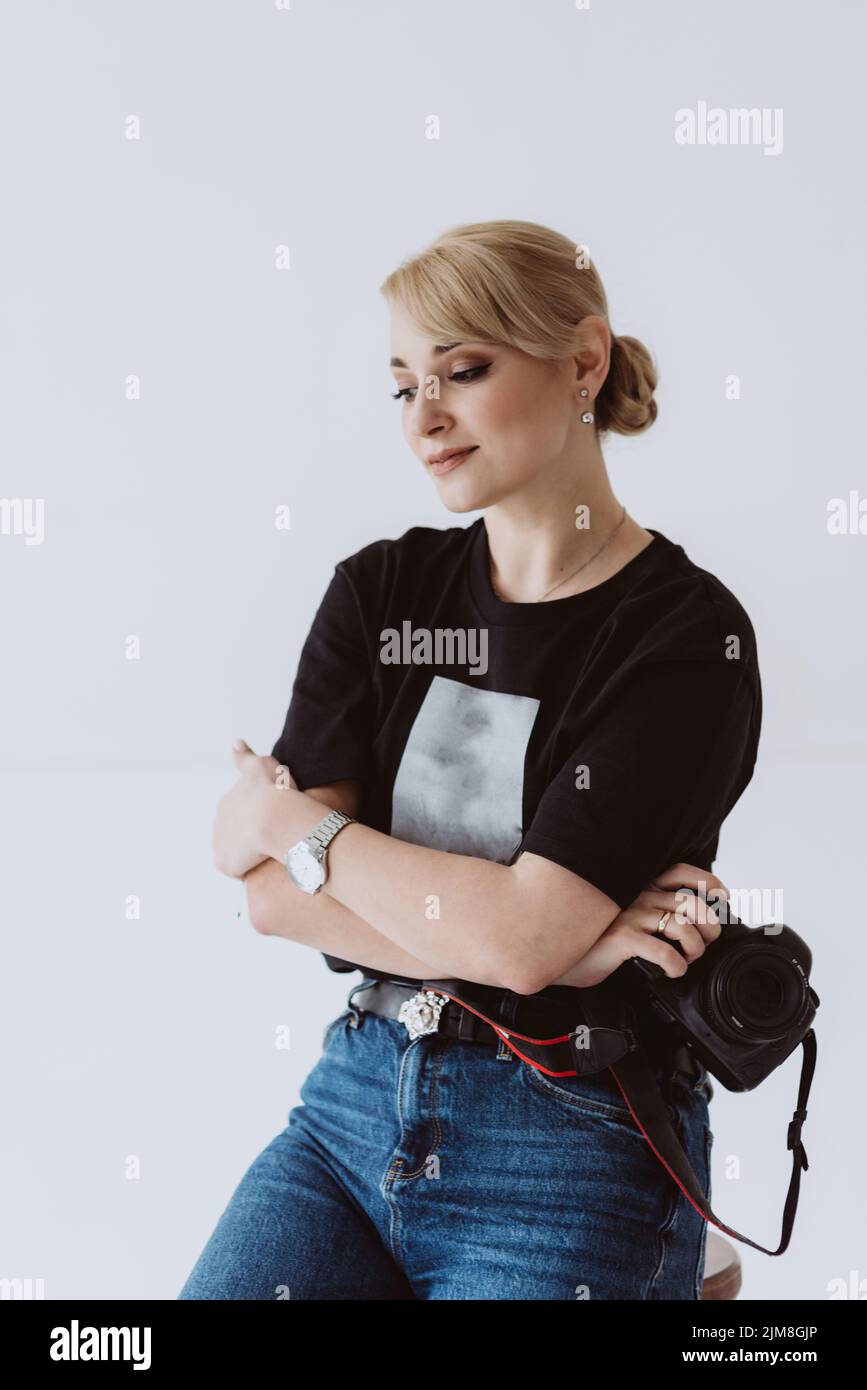 Beautiful woman photographer, journalist, posing with a camera in her ...