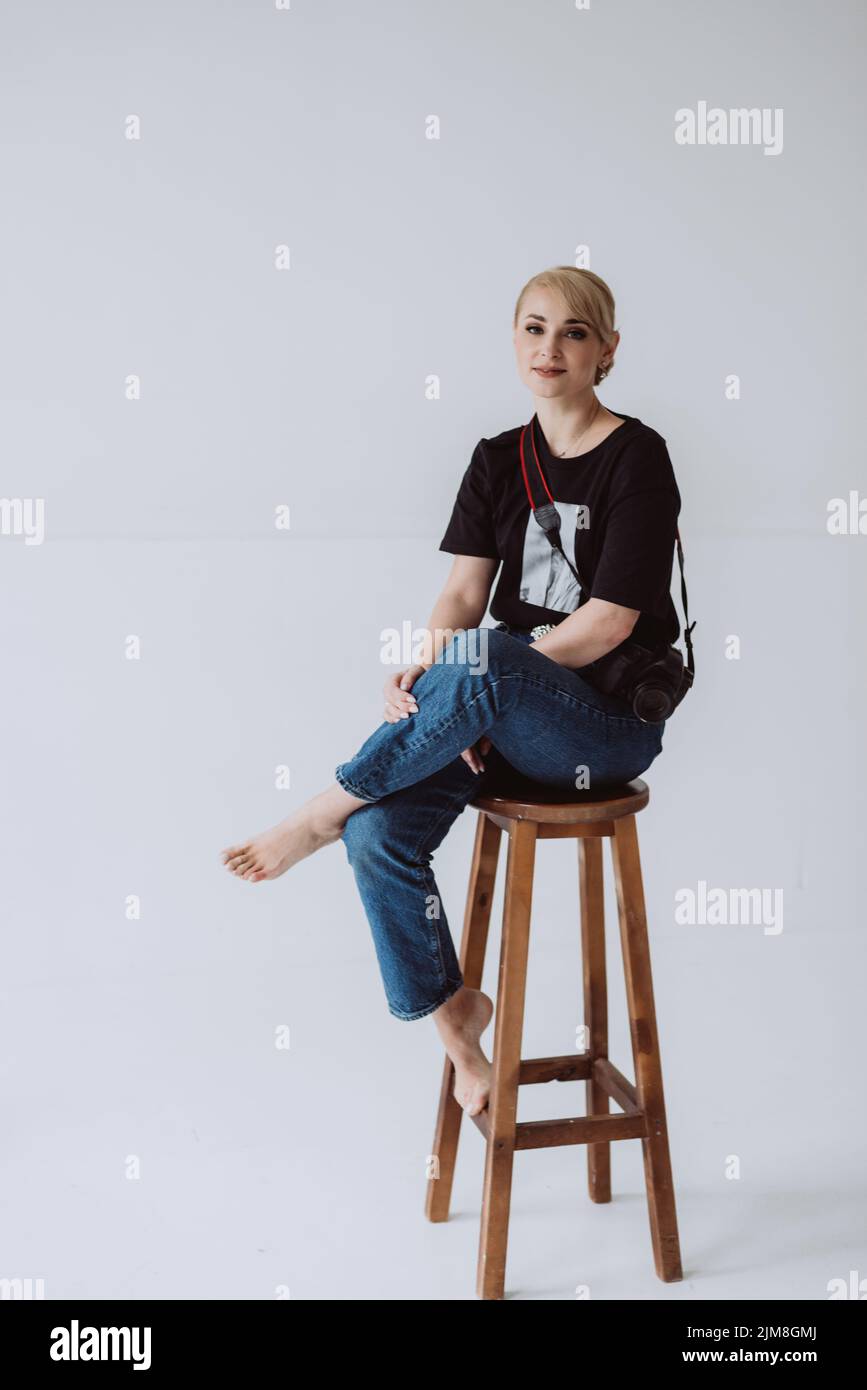 Beautiful woman photographer, journalist, posing with a camera in her ...