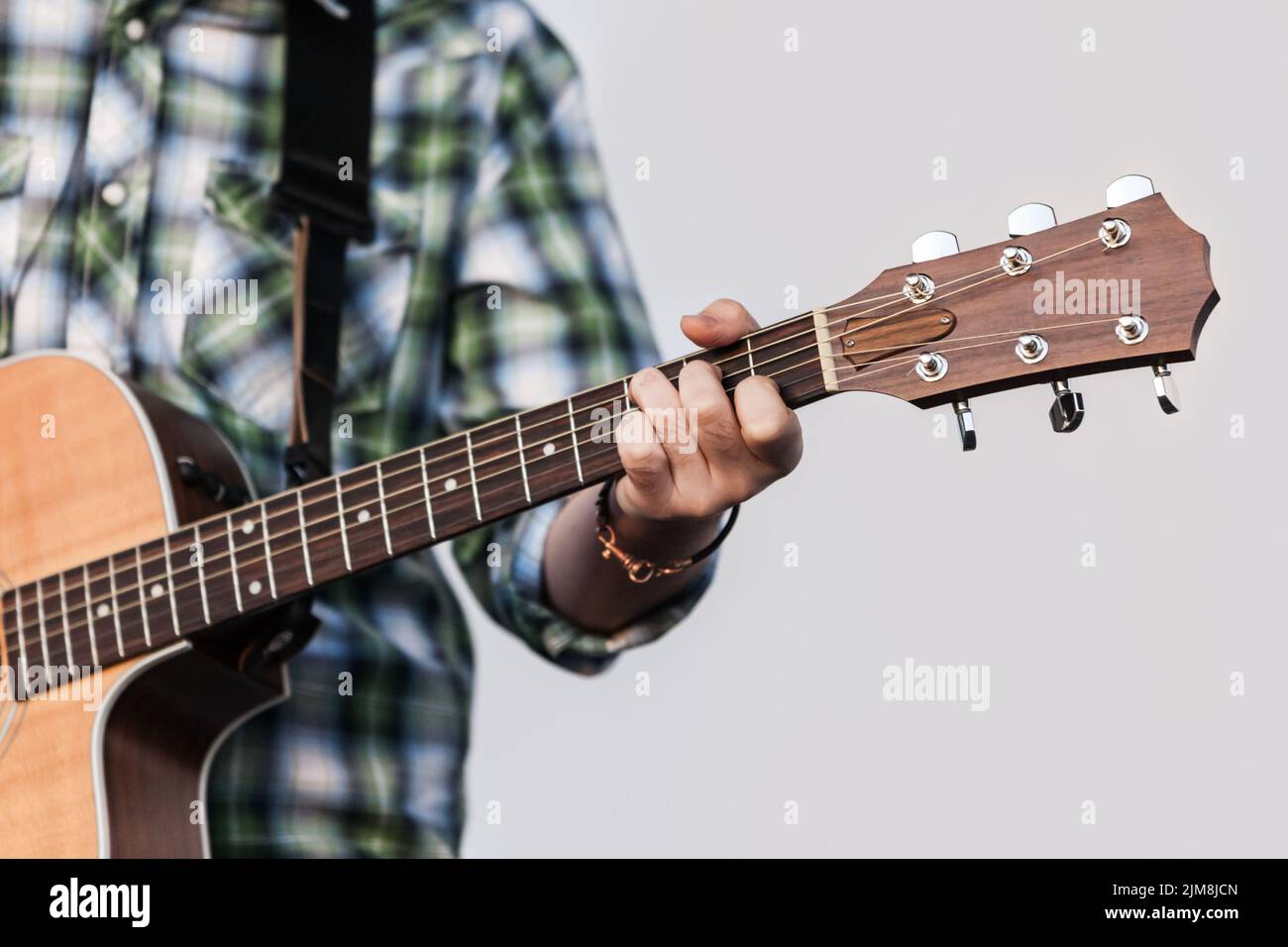 Human hand holding guitar music instrument Stock Photo - Alamy