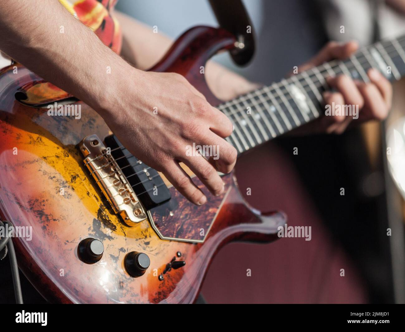 Human hand holding guitar music instrument Stock Photo - Alamy
