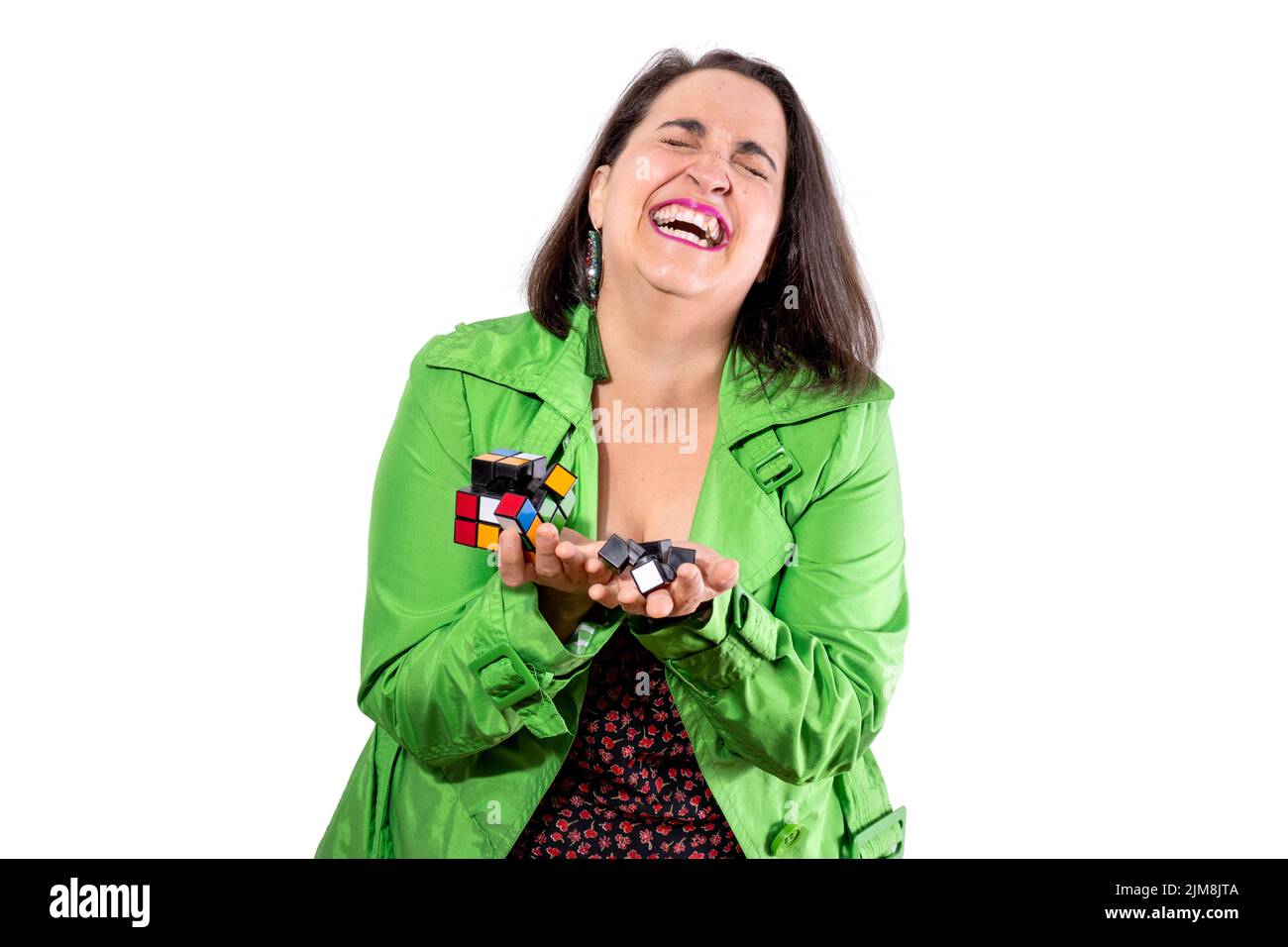 girl laughing after breaking the rubik's cube. white background Stock ...