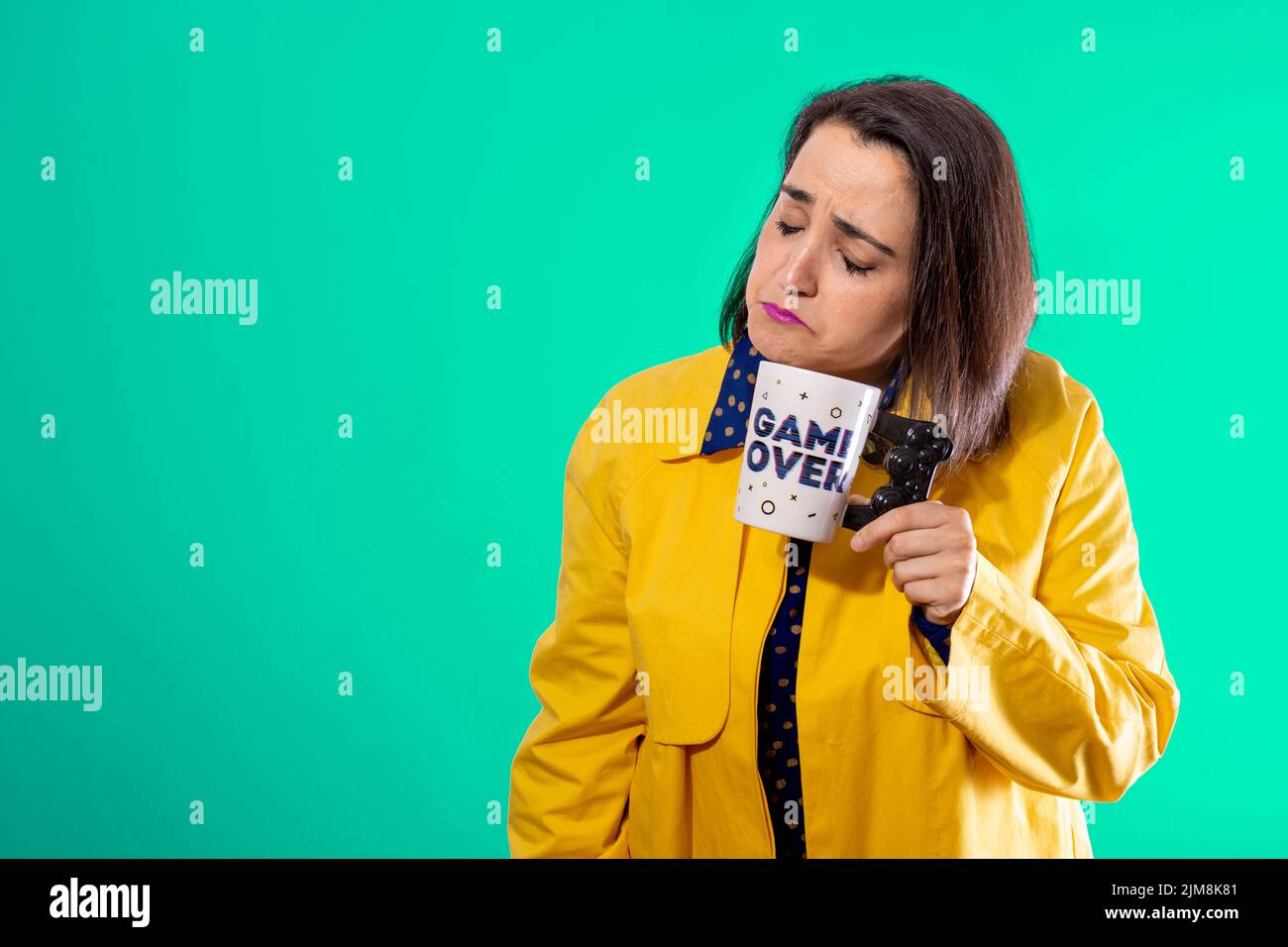 sad young girl with a GAME OVER cup Stock Photo - Alamy