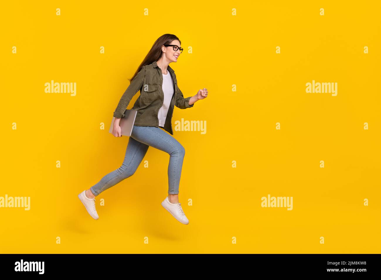 Full size profile side photo of attractive office worker girl jumping ...