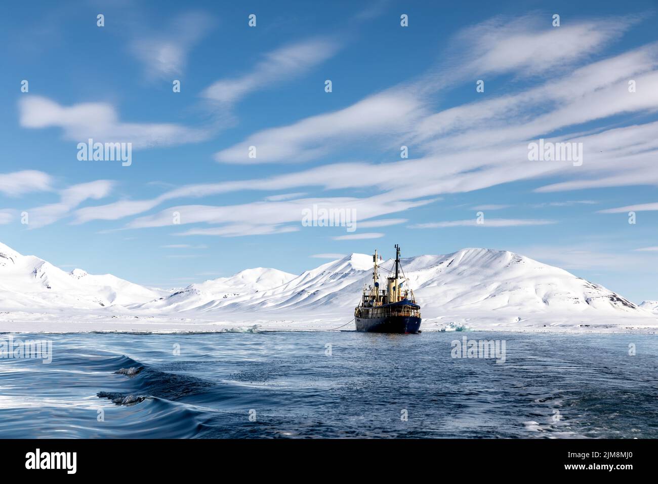 Icebreaker at anchor in the arctic waters of Svalbard, a Norwegian ...
