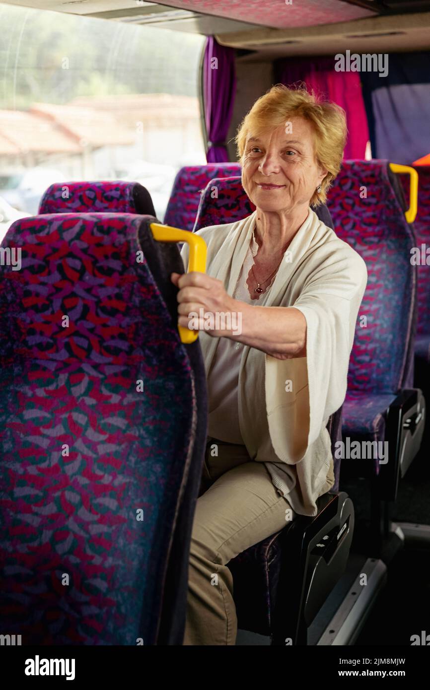 Senior Woman sitting on travel Bus and waiting for excursion Stock ...