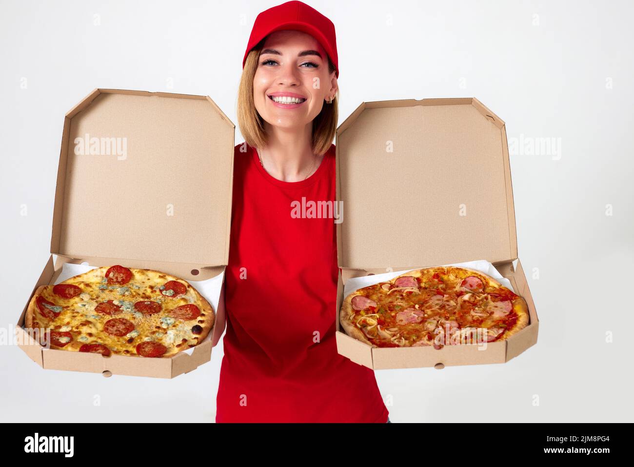 pizza delivery girl showing pizza inside boxes Stock Photo - Alamy