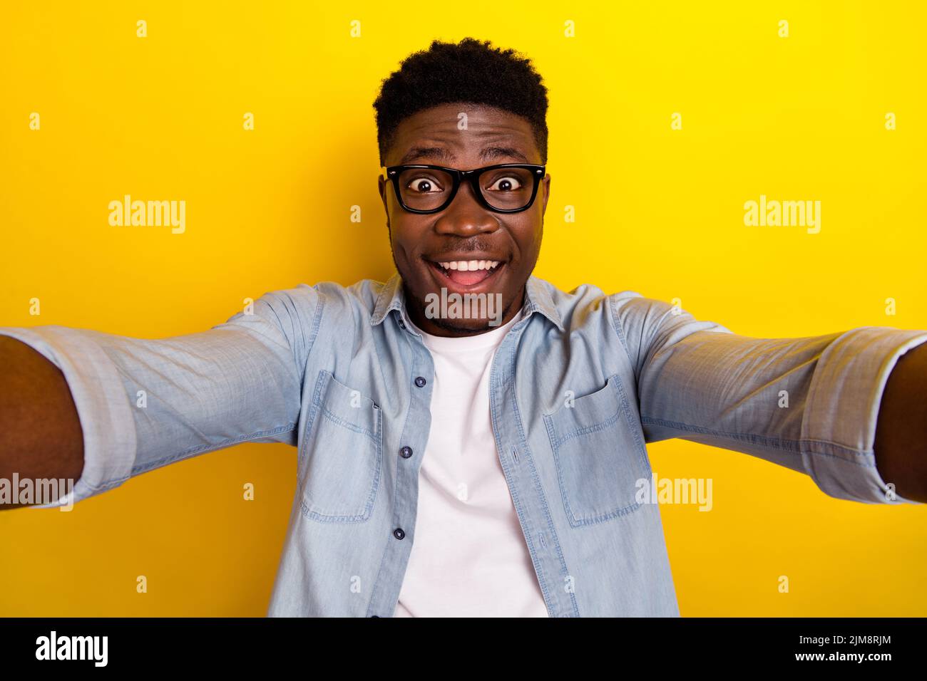 Photo of impressed young brunet guy do selfie wear eyewear jeans shirt ...