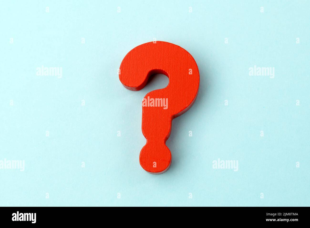 Big red question mark on a blue background. Copy the space, top view ...