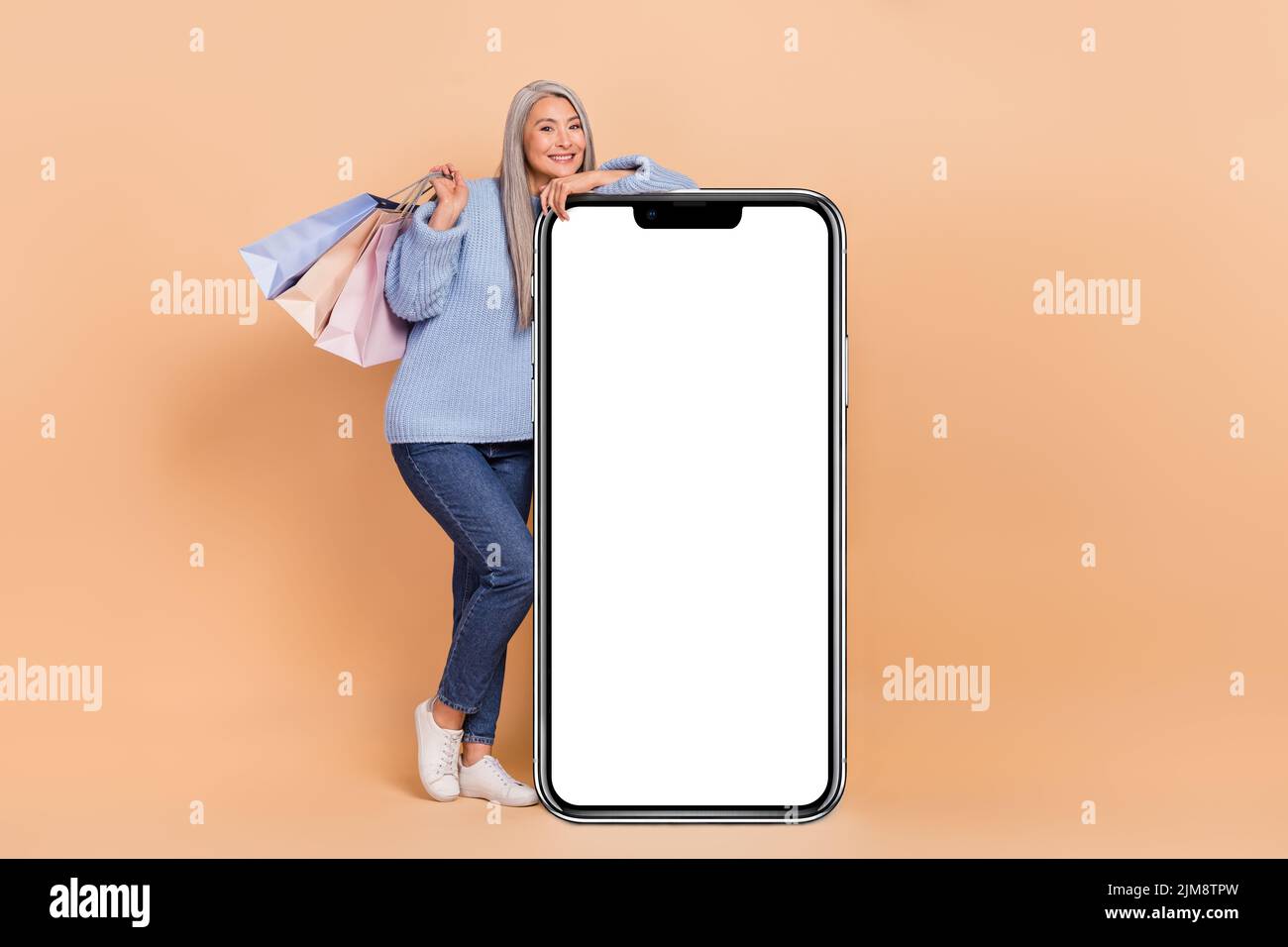 Full size photo of charming grey hair lady lean on product placard ...