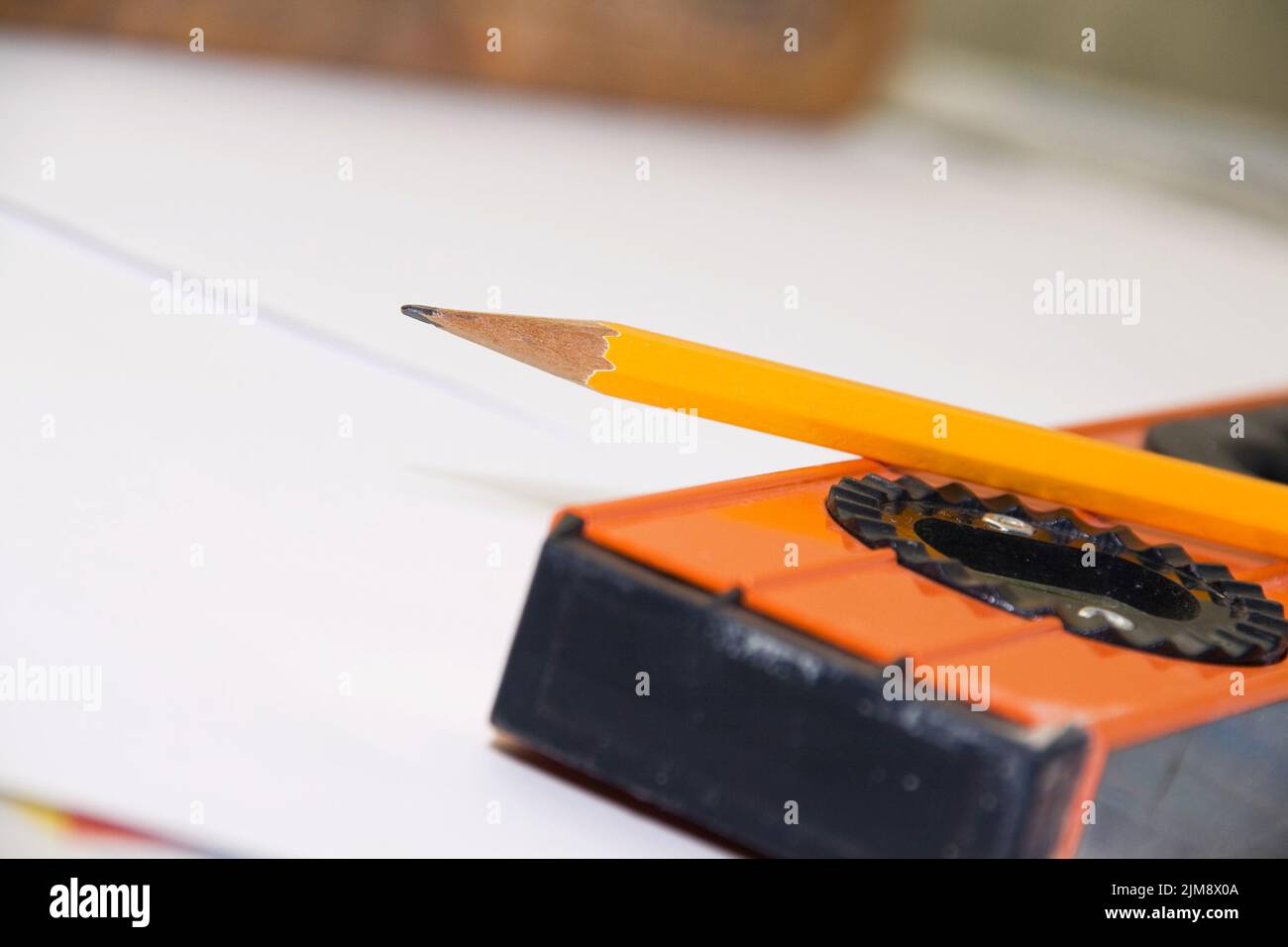 Drawing tool. yellow pencil and level Stock Photo - Alamy