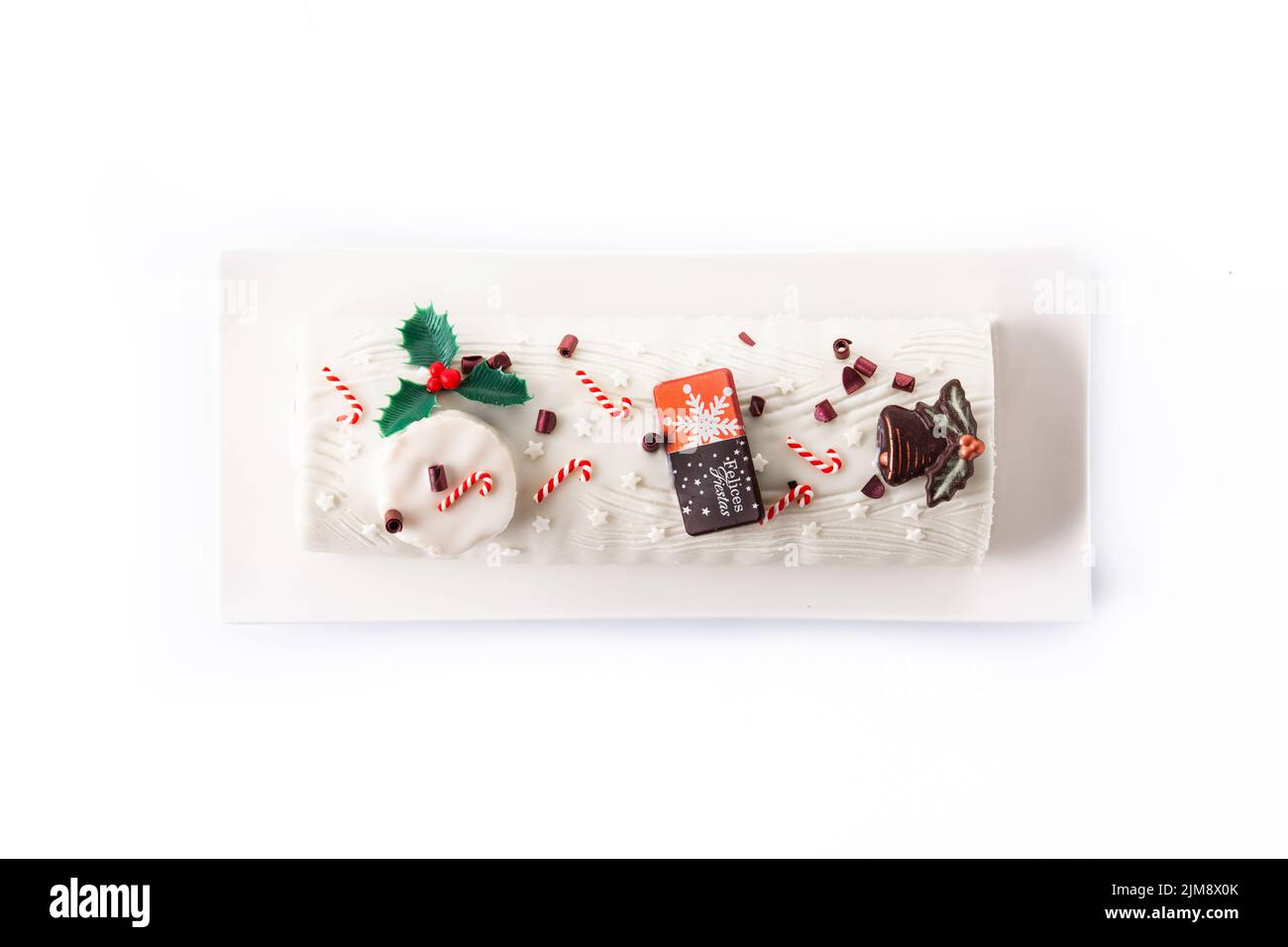 White chocolate yule log cake isolated on white background Stock Photo ...