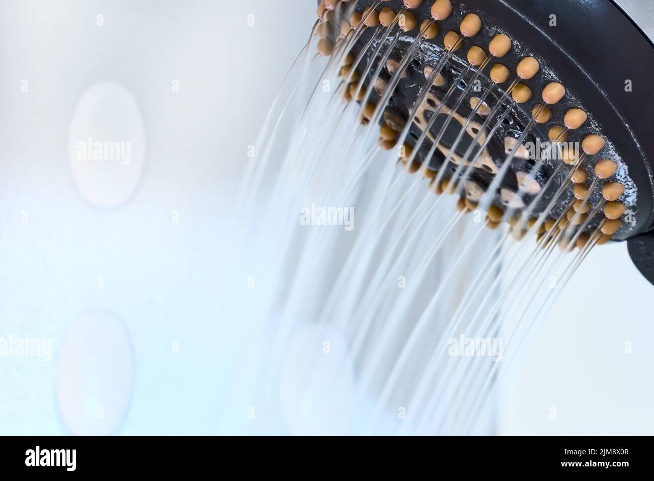 Flow watering from shower handle Stock Photo - Alamy